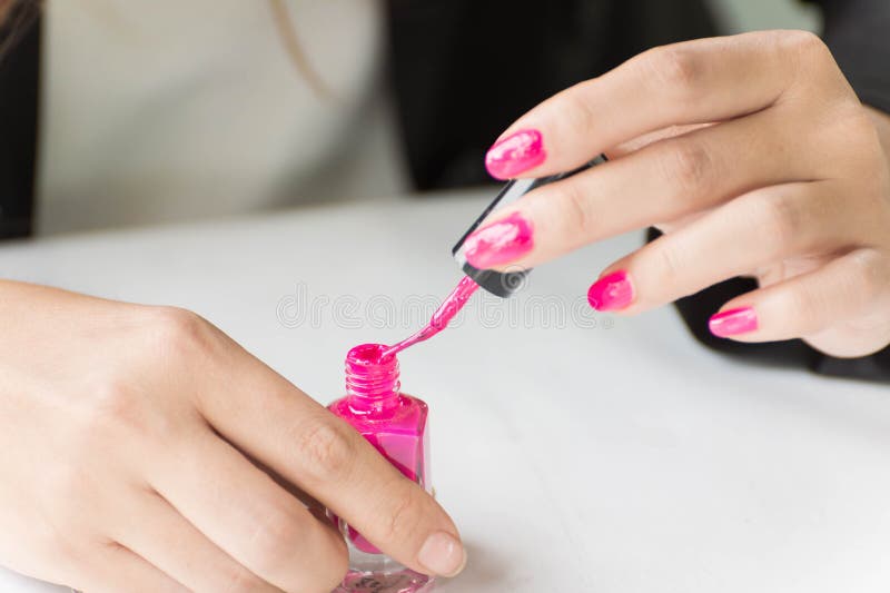 Woman Applying Pink Nail Polish on Hand Stock Image - Image of ...