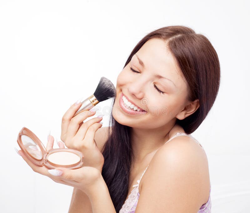 Woman applying powder stock image. Image of brunette - 19716929