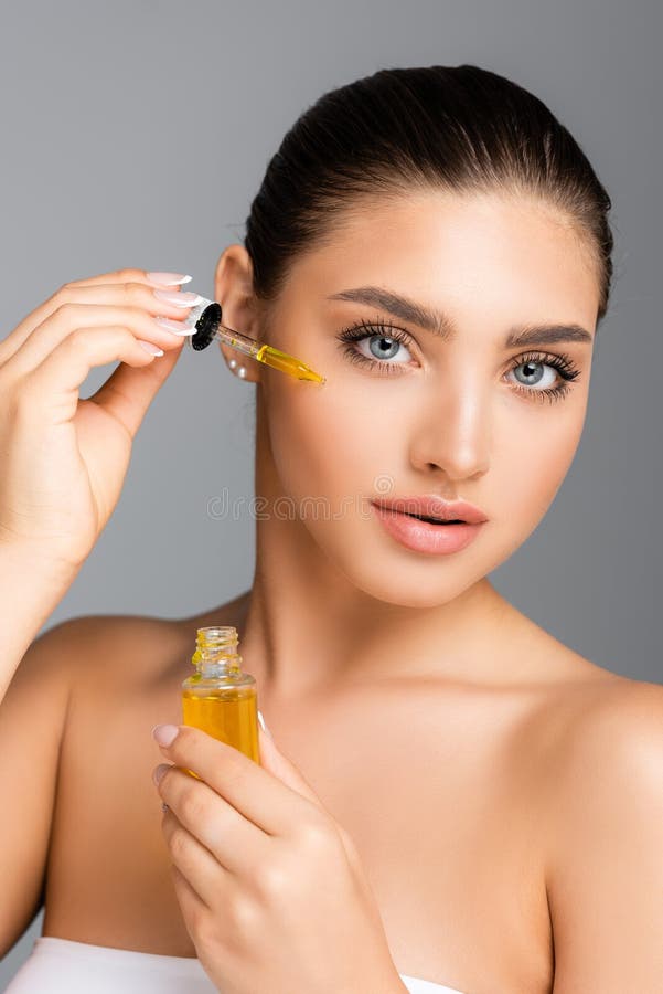 Woman Applying Serum on Face Isolated Stock Image - Image of body, skin ...