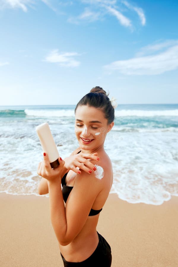 Woman Applying Sunscreen Creme On Tanned Shoulder Skincare Body Sun