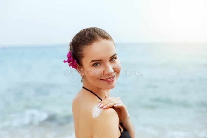Woman Applying Sunscreen Creme On Tanned Shoulder Skincare Body Sun