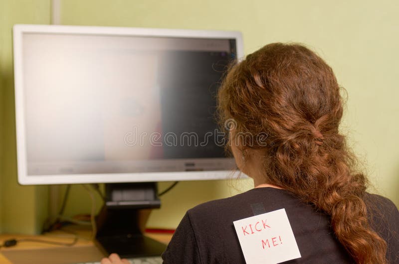 A Woman with an April Fool S Note on Her Back Works at a Computer Stock ...