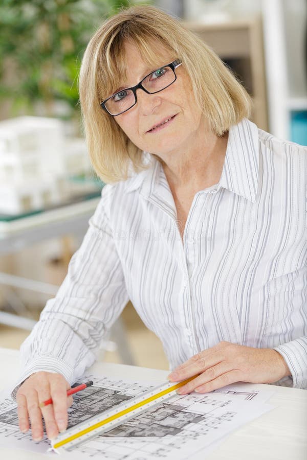 Woman Architect in Formal Wear Holding Pencil and Ruler Stock Photo ... Woman Architect in Formal Wear Holding Pencil and Ruler Stock Photo ...