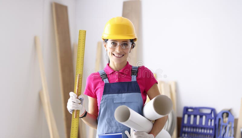 Woman Architect Holding Ruler and Paper in Workshop Stock Photo - Image ...
