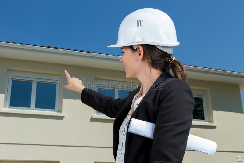Woman Architect Wearing Helmet Holding Blueprints Stock Photo - Image ... Woman Architect Wearing Helmet Holding Blueprints Stock Photo - Image ...