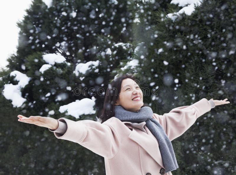 Woman with Arms Outstretched Feeling the Snow Stock Image - Image of ...