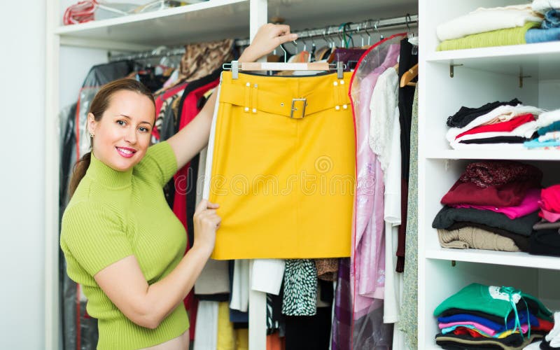 263 Woman Arranging Clothes Wardrobe Stock Photos - Free & Royalty-Free ...