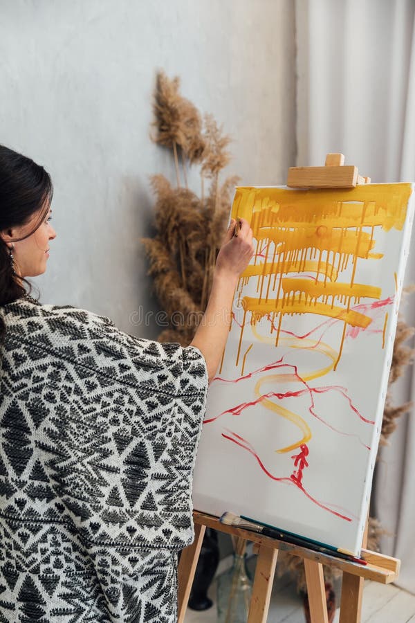 A Woman Artist Stands at an Easel and Draws Stock Photo - Image of ...