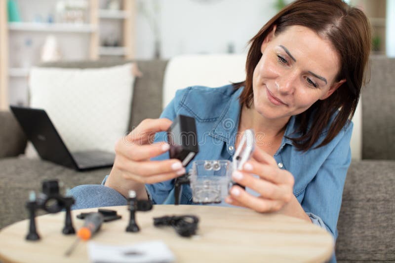 Woman Assembling Electronic Device Stock Image - Image of playing ...