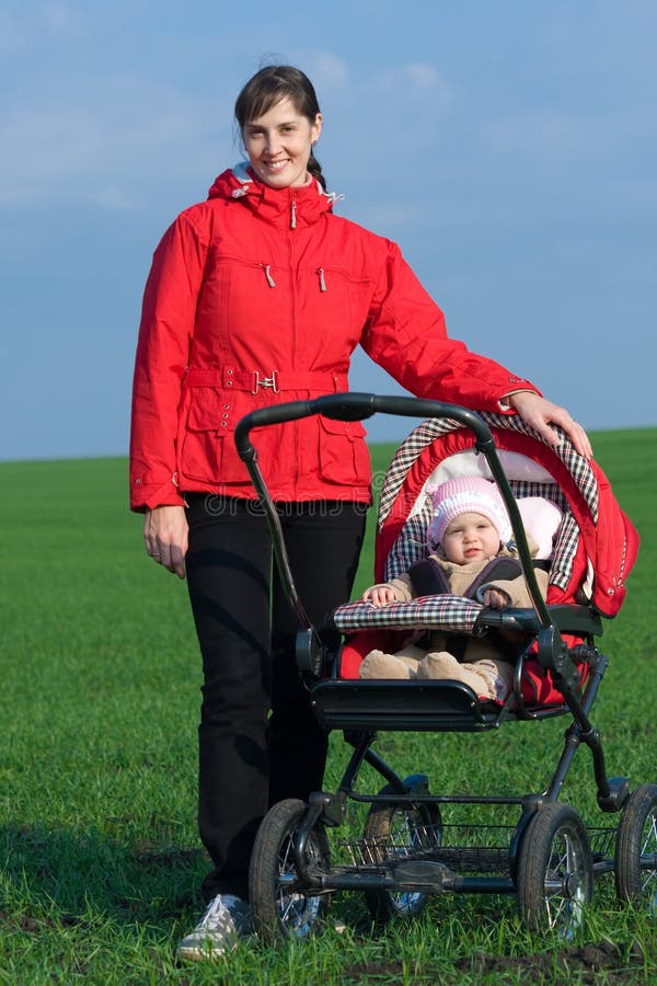Woman with baby buggy stock image. Image of motherhood - 8499167