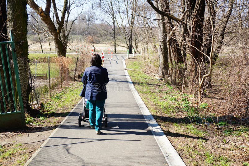 Woman with baby buggy stock photo. Image of natural, buggy - 39041606