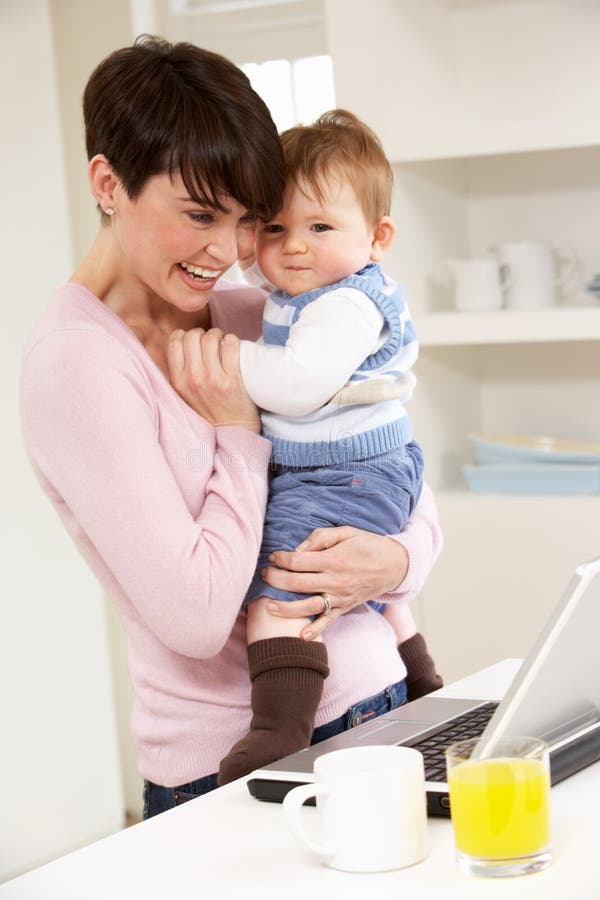 Man with Baby Working from Home Using Laptop Stock Image - Image of ...
