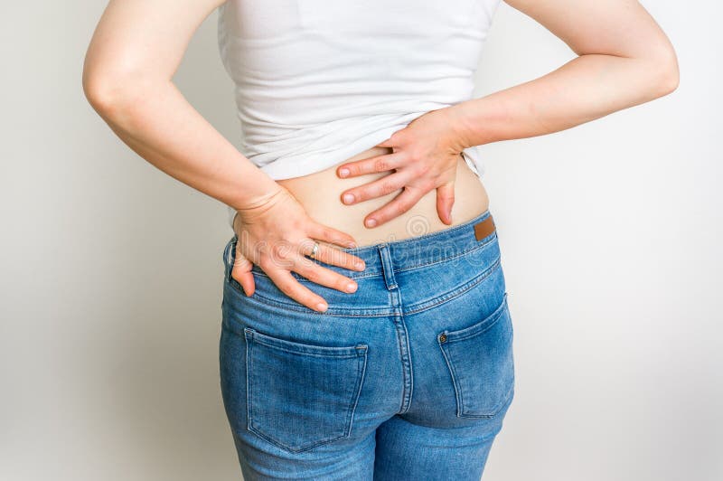 Woman with Back Pain Holding Her Aching Back Stock Photo - Image of ...
