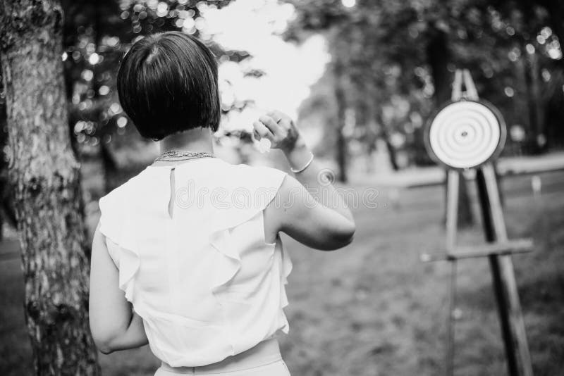 Woman Back Playing Darts Outside Throws Target Stock Image - Image of ...