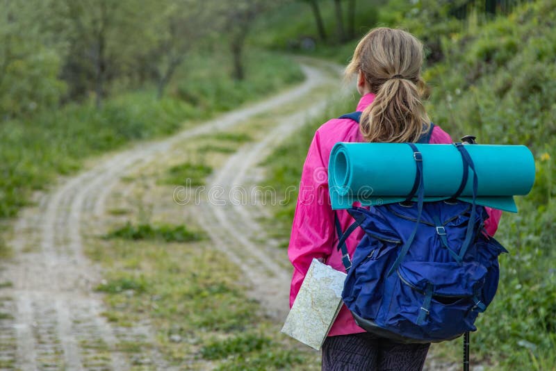 Woman with Backpack in Landscape with Country Road Practicing Hiking ...