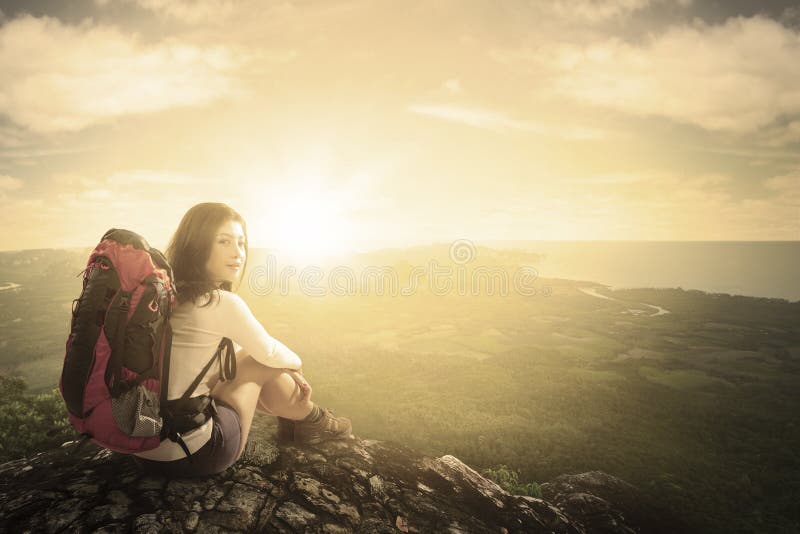 Woman with Backpack Sitting on Mountain Stock Image - Image of outdoor ...