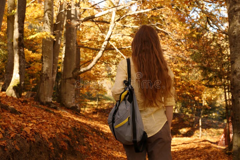 Woman with Backpack Walking in Autumn Forest. Stock Photo - Image of ...