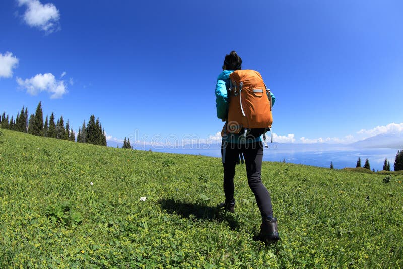 Woman Backpacker Hiking on Beautiful Mountain Peak Trail Stock Photo ...