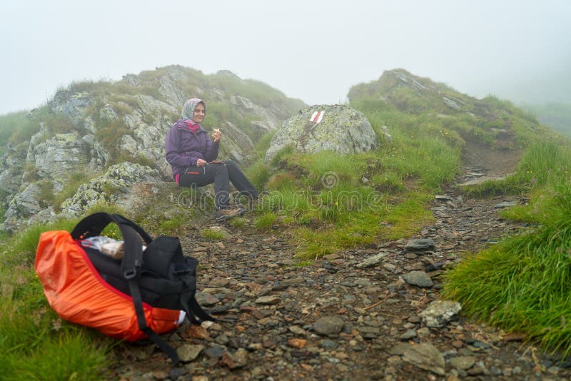Woman Backpacker Resting on the Trail Stock Photo - Image of adventure ...
