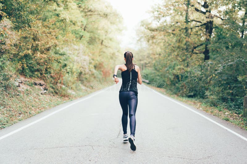 Woman Backs Running on the Road Stock Image - Image of park, rear ...