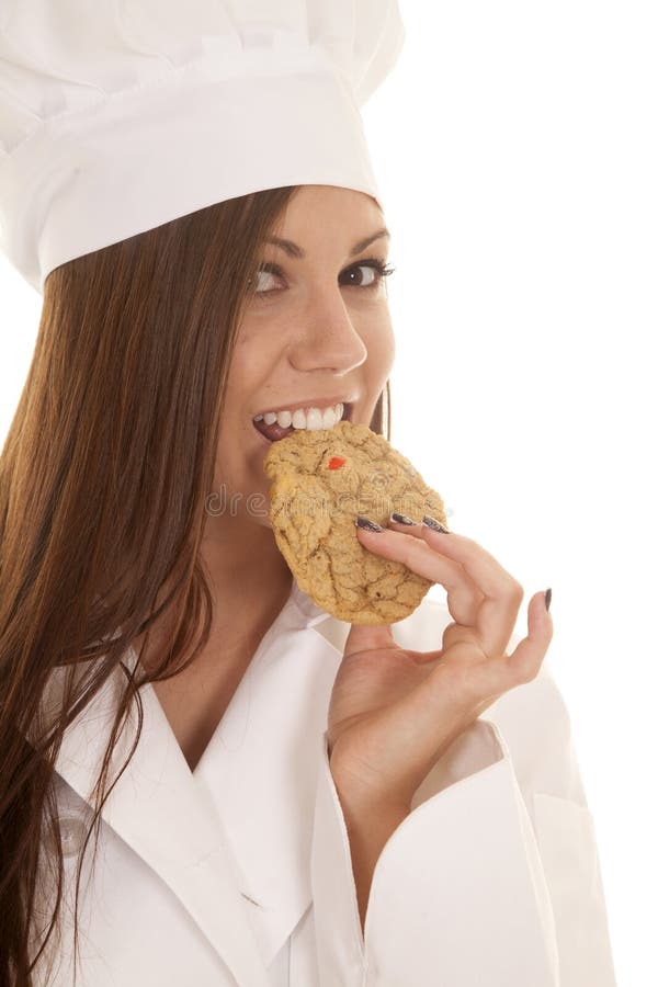 Woman Baker Bite a Cookie Looking Stock Photo - Image of caucasian ...