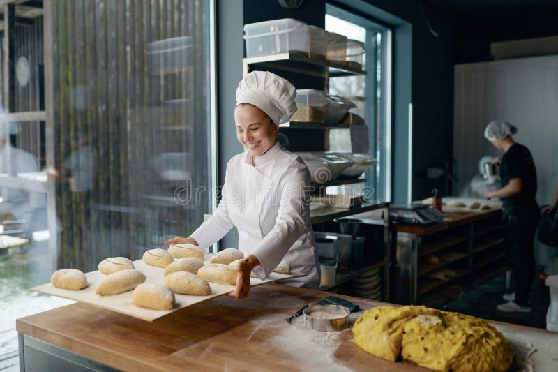 A Woman Baker Making of Traditional Yeast Buns with Cheese Stock Photo ...
