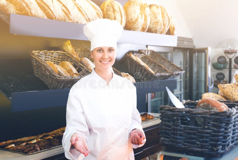 Woman Baker is Offering Fresh Baguettes and Buns Stock Image - Image of ...
