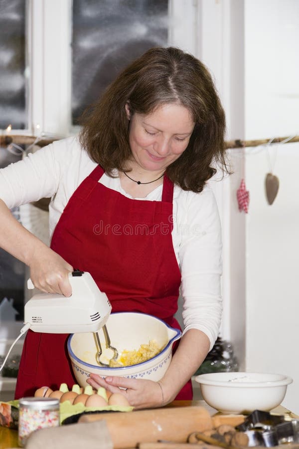 Woman is baking cookie stock image. Image of cookie, apron - 59249937
