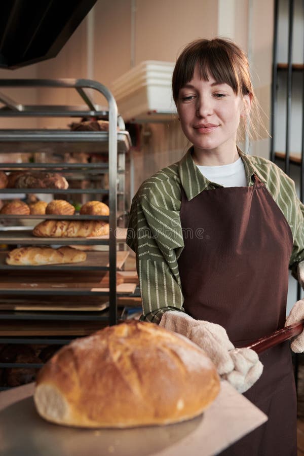 Woman baking fresh bread stock image. Image of business - 219833331