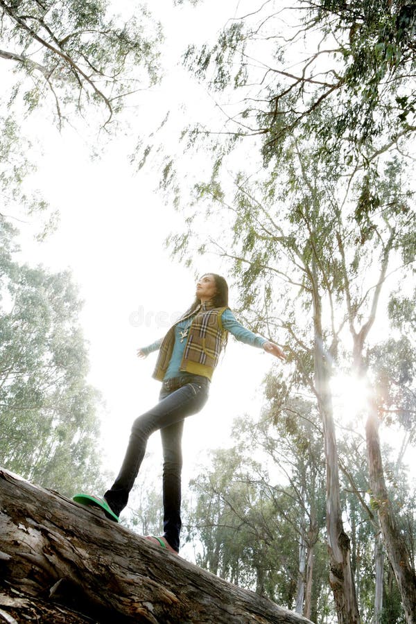 Woman balancing on log stock image. Image of adult, girl - 5233455