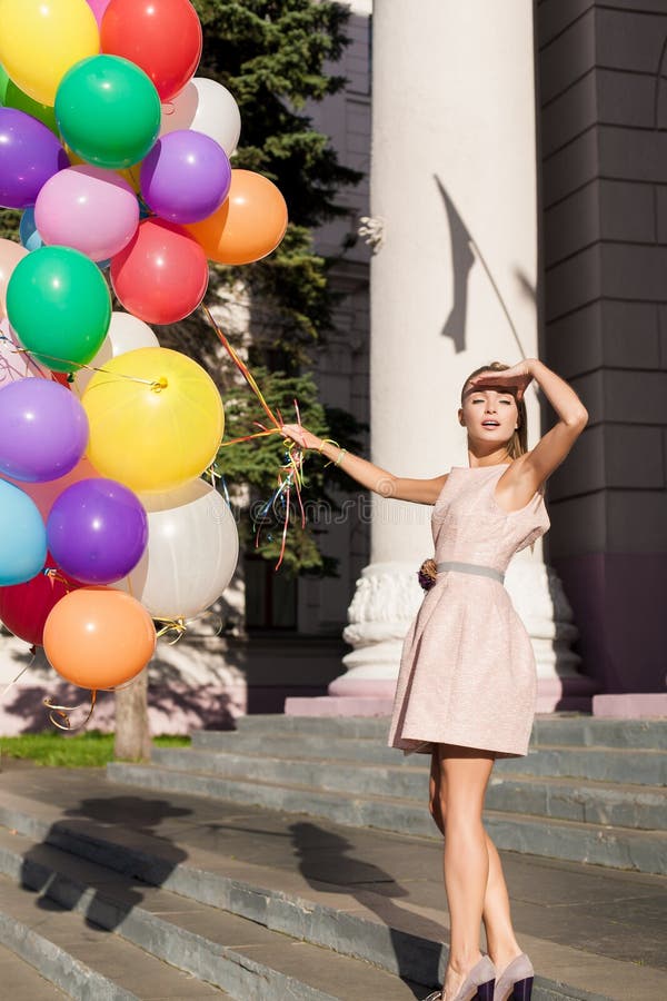 Woman with balloons stock image. Image of playful, city - 26897761