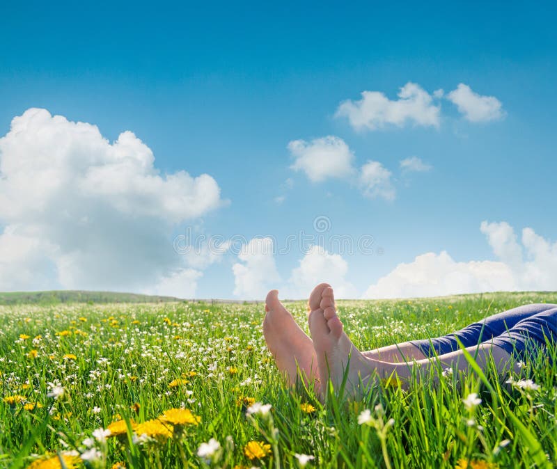 Bare feet on spring grass stock photo. Image of human - 113312248