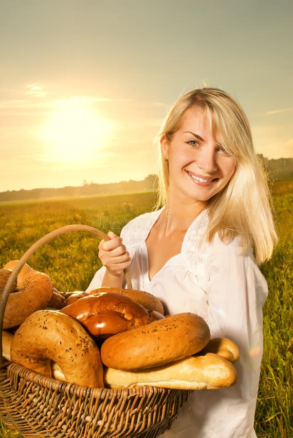 Woman with a baked bread stock image. Image of close, beauty - 6199689