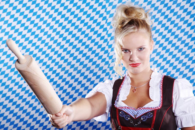 Woman in Bavarian Outfit and Rolling Pin Stock Photo - Image of food ...