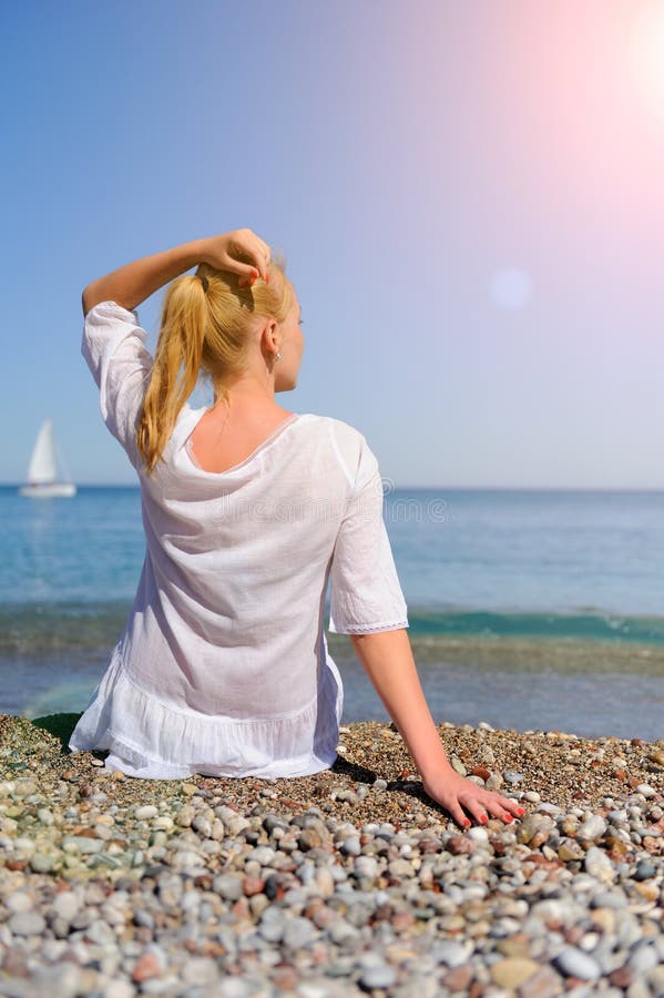 Woman on a beach stock photo. Image of relaxation, bliss - 74480596