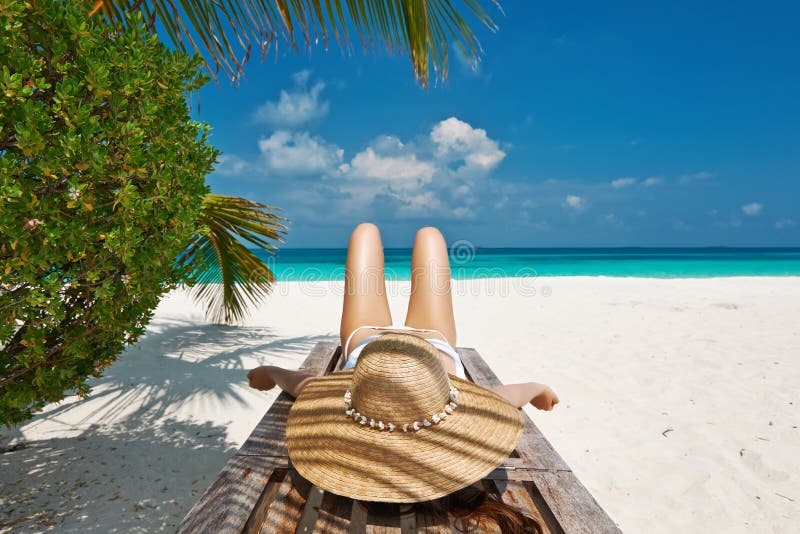 Woman at Beach Lying on Chaise Lounge Stock Photo - Image of palm, blue ...