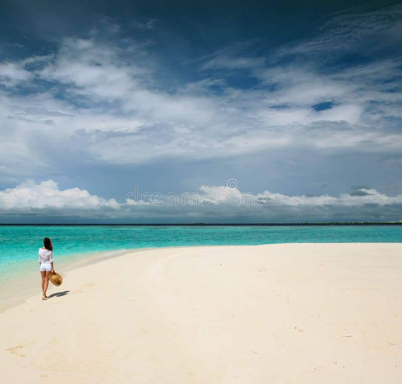 A Woman is Walking Along the Beach Stock Photo - Image of vacation ...