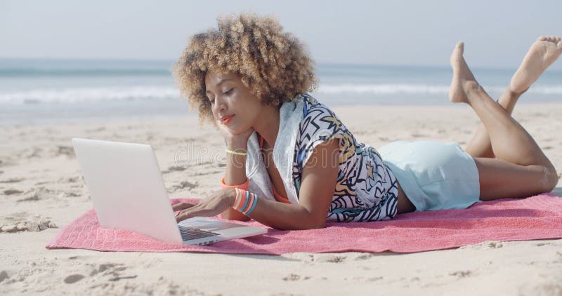 Woman on the Beach Using a Computer Stock Photo - Image of laptop ...
