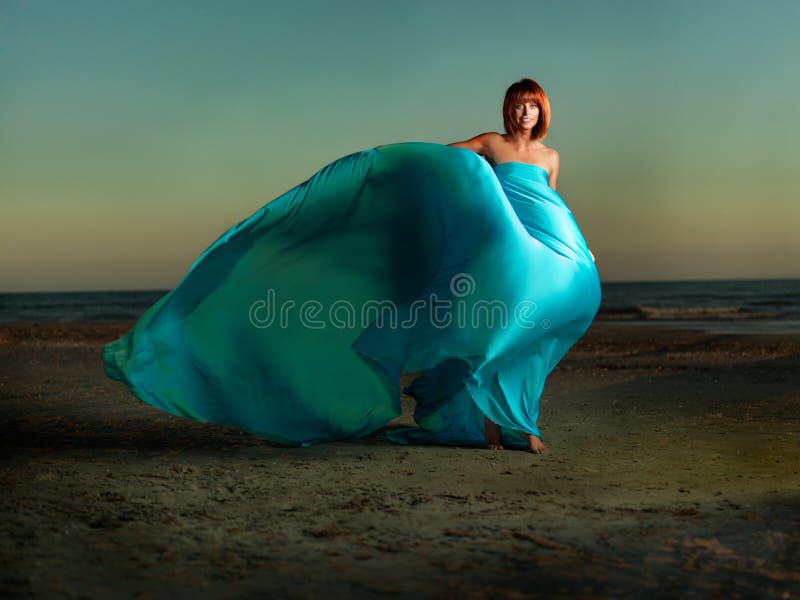 Woman on Beach Wind Blowing Blue Dress Stock Image - Image of beach ...