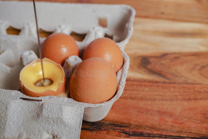 Woman Beating an Egg in Its Own Shell with a Small Mixer. Stock Image ...