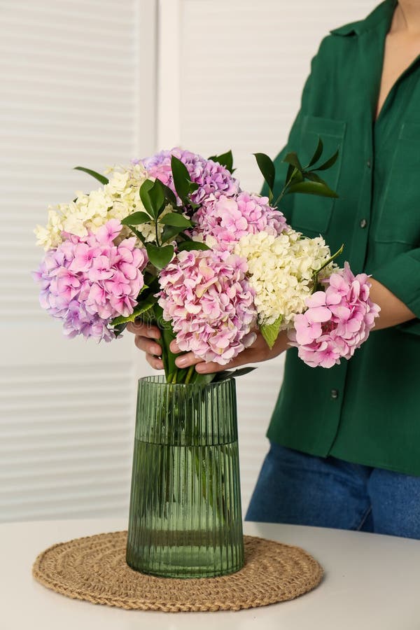 Woman with Beautiful Hydrangea Flowers at Table, Closeup. Interior ...