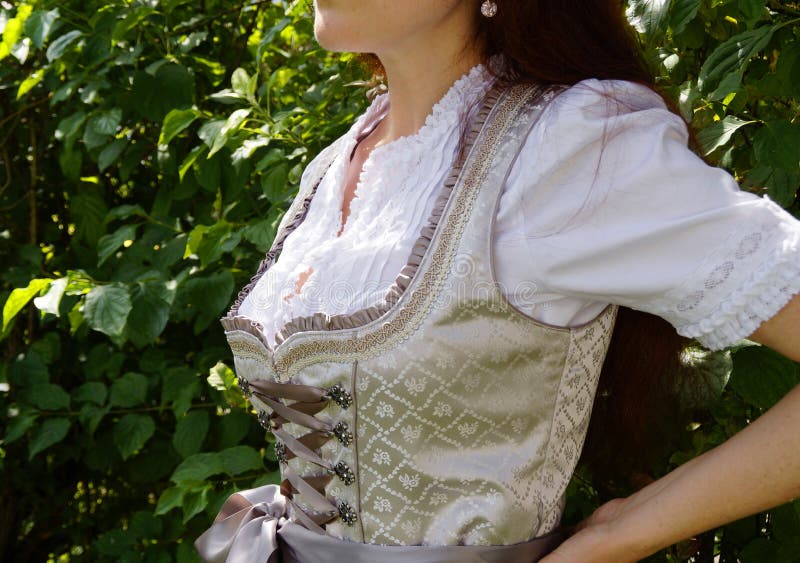 Woman In Traditional Bavarian Or Austrian Dirndl Dress At Bavarian