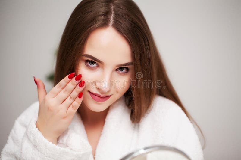 Woman With Beauty Face Touching Healthy Facial Skin Portrait Stock