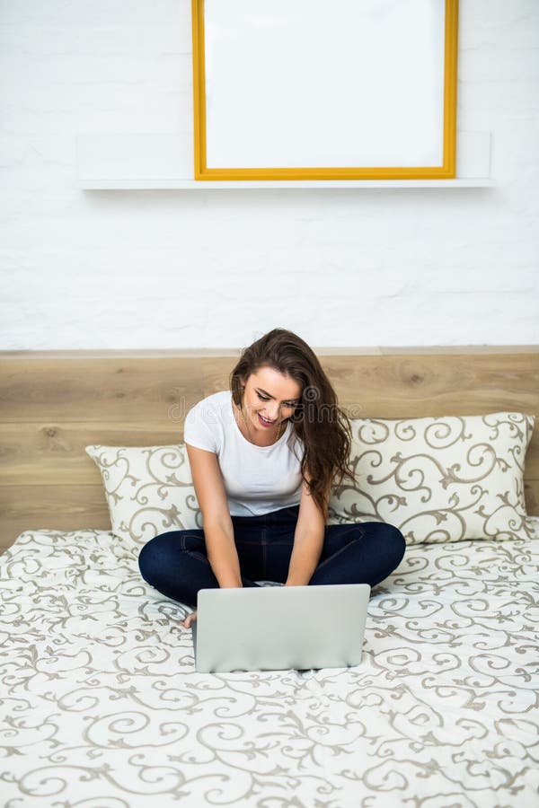 Woman in Bed with Laptop on Legs at Home Stock Photo - Image of bedroom ...
