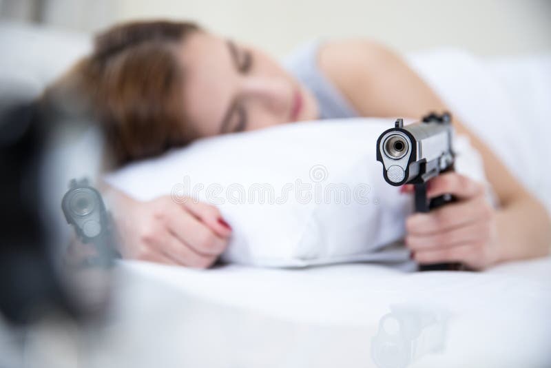 Woman in Bed Sleeps with Hand on Gun Stock Photo - Image of hand, awake ...