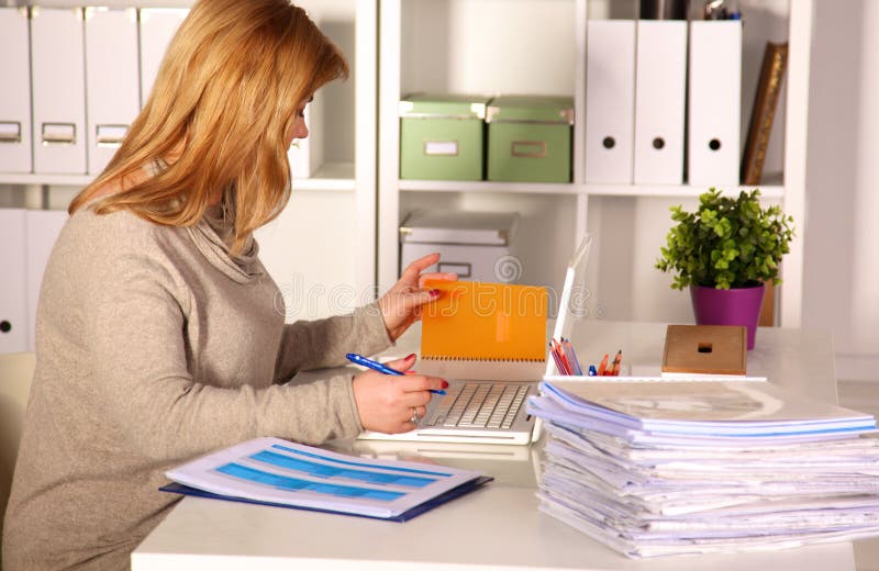 The Woman Behind the Desk in the Office Stock Image - Image of desk ...