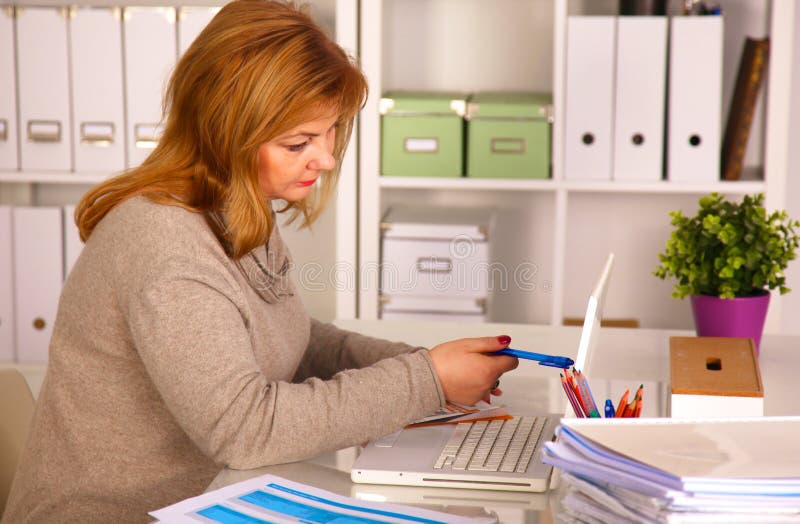 The Woman Behind the Desk in the Office Stock Photo - Image of notebook ...