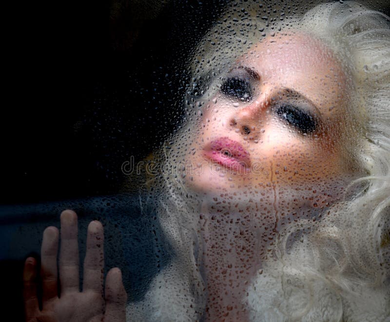 Woman Behind Glass stock image. Image of blond, contemplation - 7756629