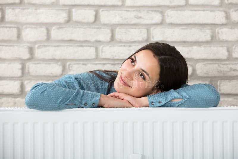 Woman Behind the Heating Radiator Stock Photo - Image of heat ...
