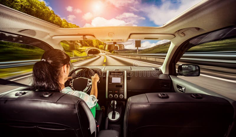 Woman Behind the Wheel of a Car. Stock Photo - Image of destinations ...